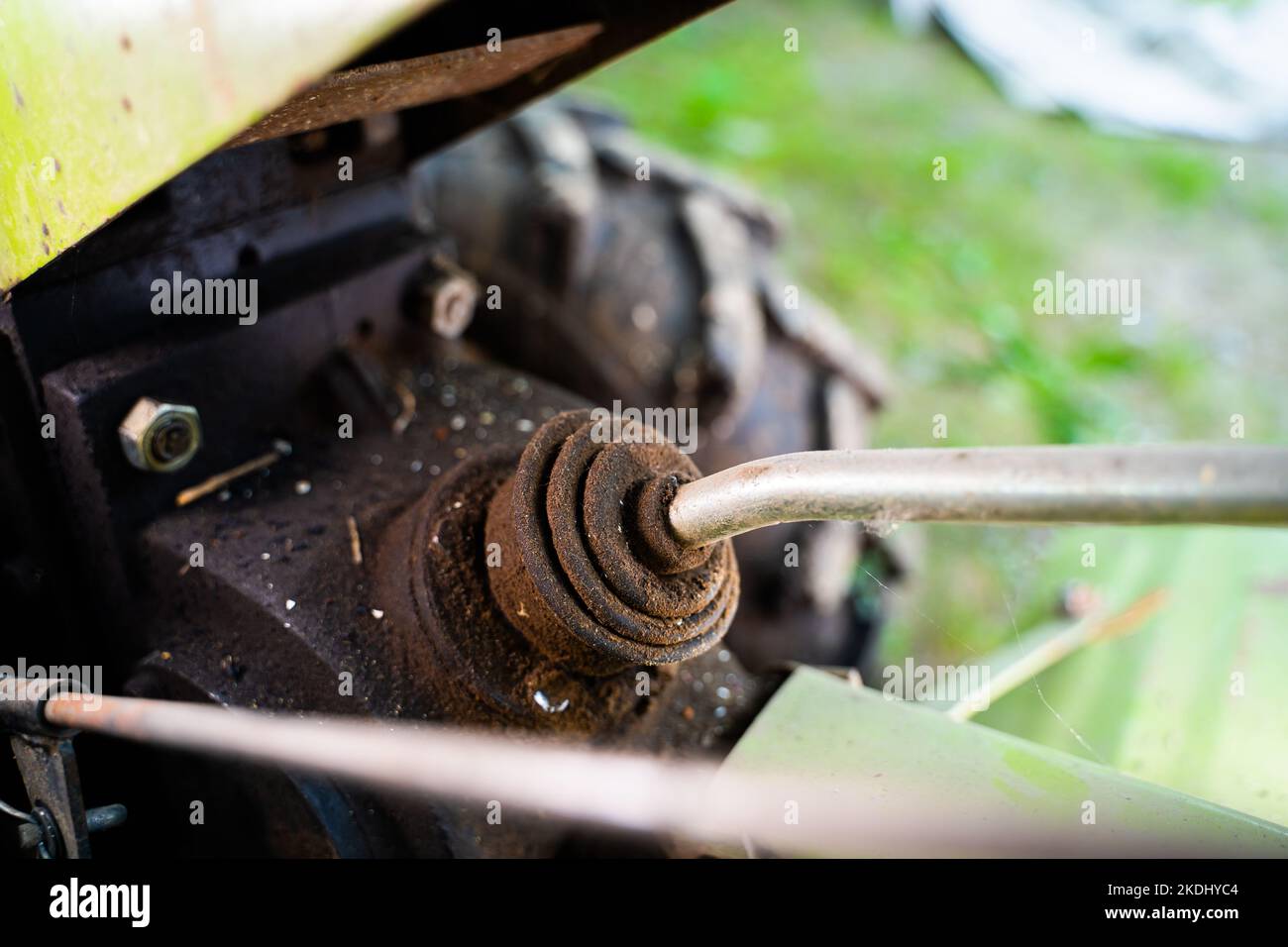 Lever connecting the cutter drive on a walk-behind tractor close-up ...