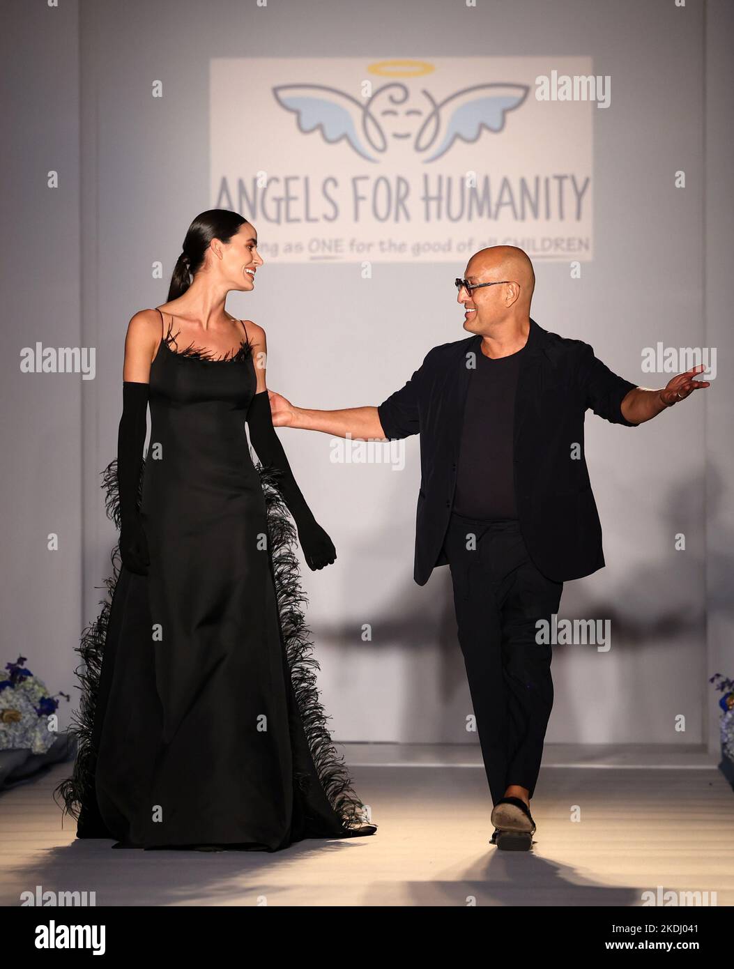 MIAMI, FLORIDA - NOVEMBER 06: Designer Angel Sanchez (R) walks the ...