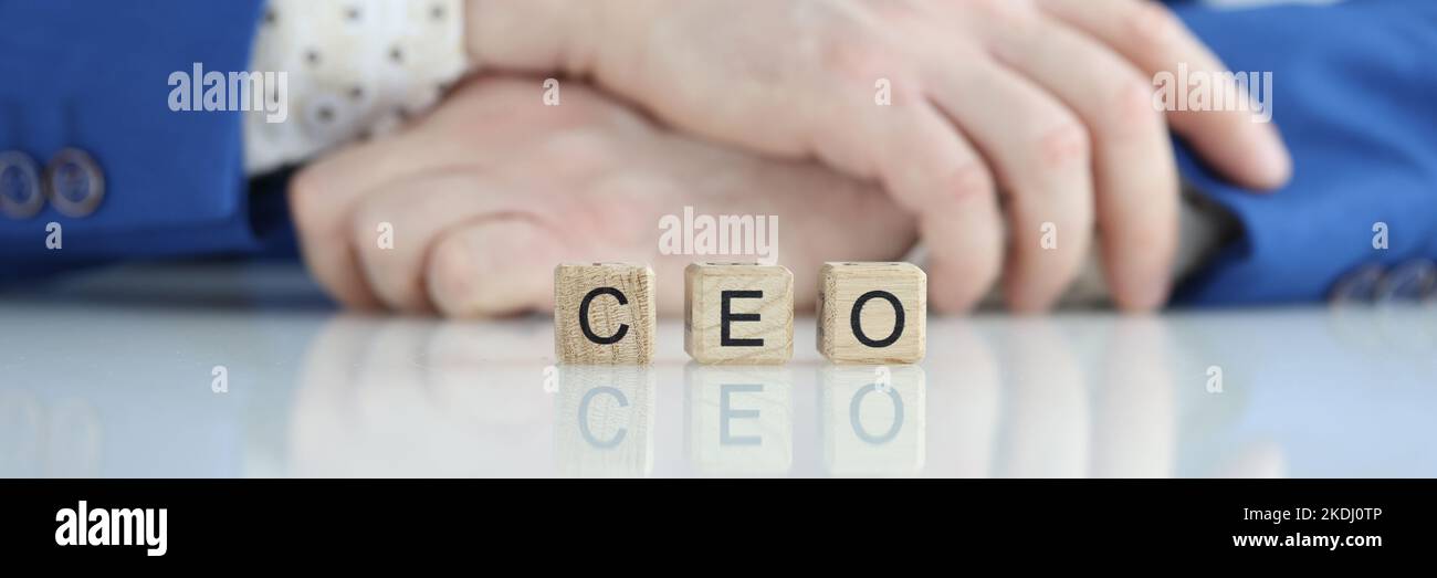 Cubes with text CEO and in background successful businessman Stock ...