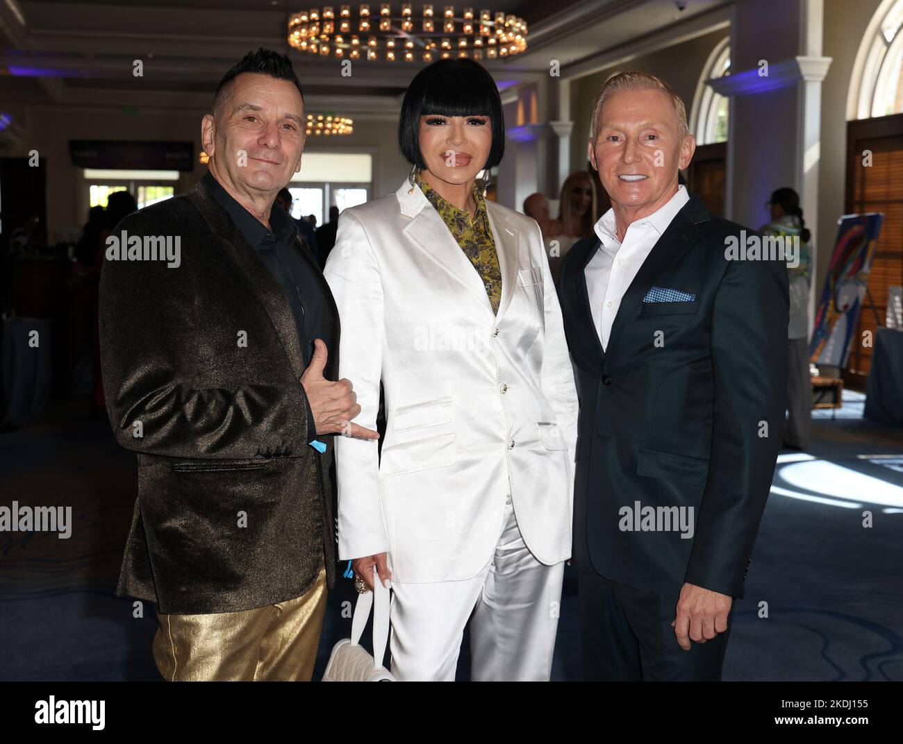 MIAMI, FLORIDA - NOVEMBER 06: Ron Bloom, Marta Bloom and Tim Carr ...