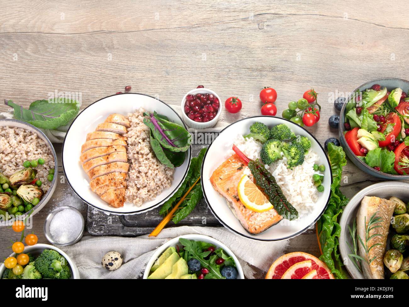 Table of various healthy food dishes. Healthy food assortment. Dieting ...