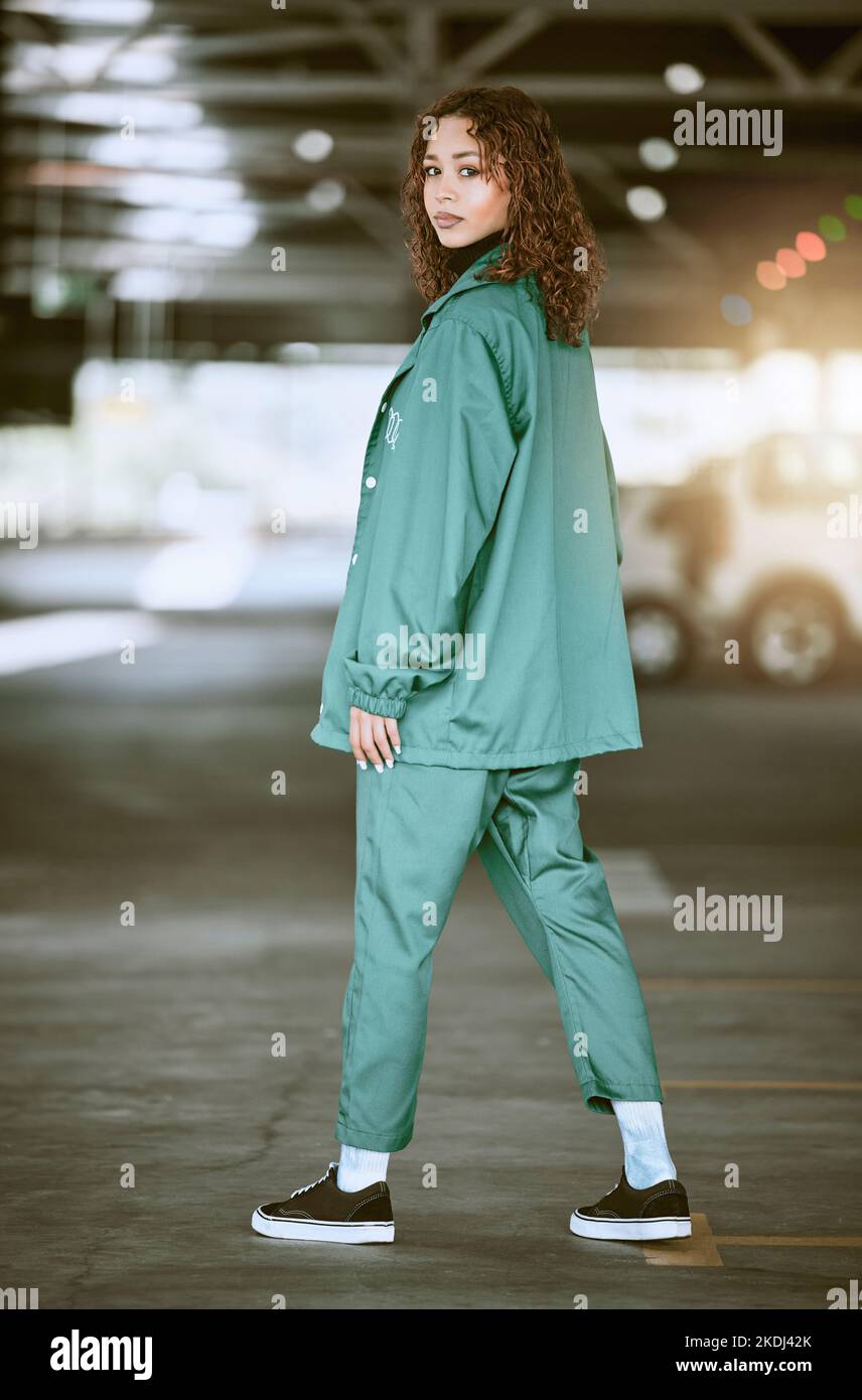 Fashion, style and woman in urban parking lot posing in stylish, trendy ...