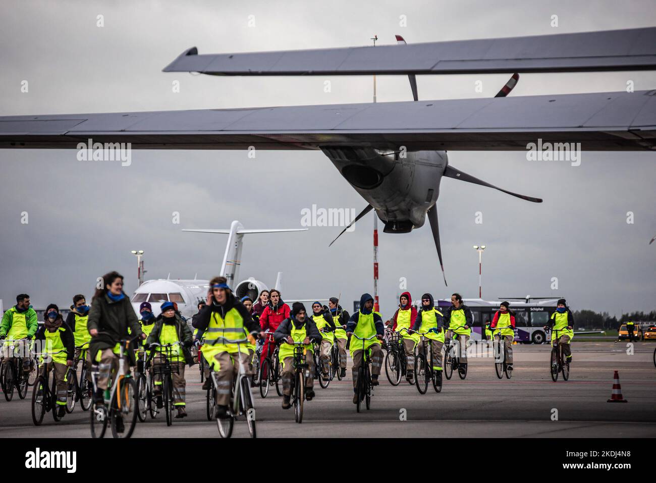 Activists ride at the wheel, as they circle the private jets at ...