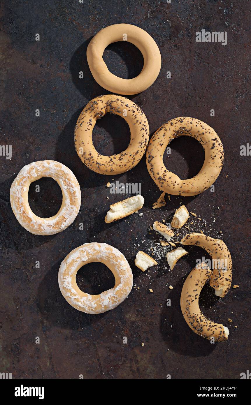 High angle view of various homemade bagels on a metal baking tray ...