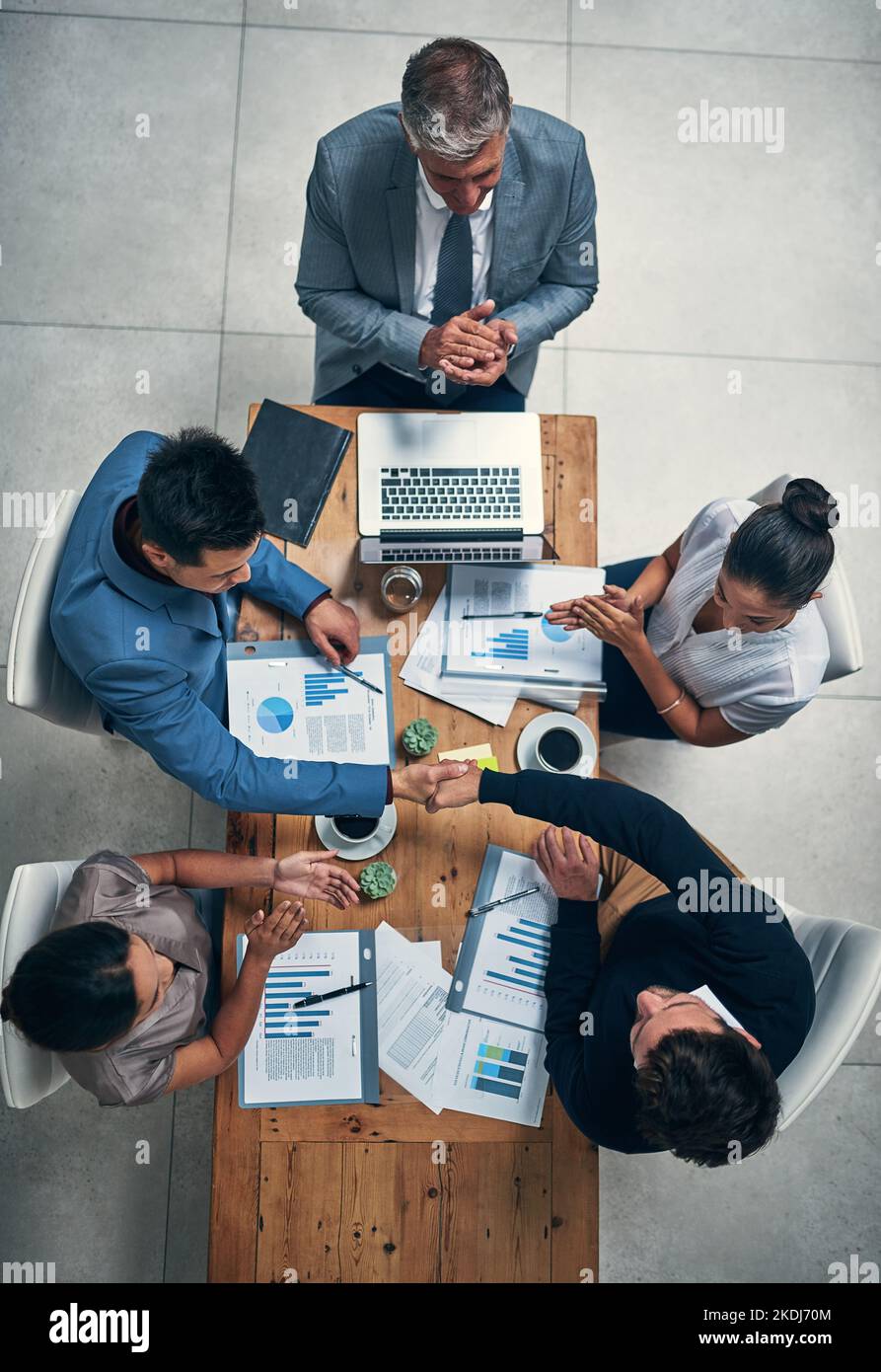 Celebrating a new venture together. High angle shot of two ...
