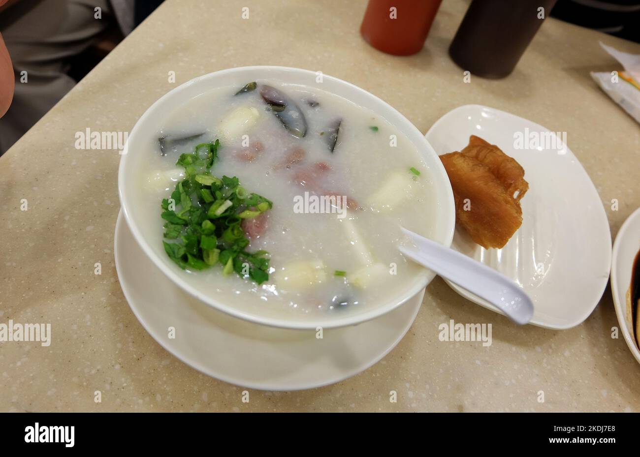 Close up Mixed Congee rice porridge served with Chinese donut (Deep ...