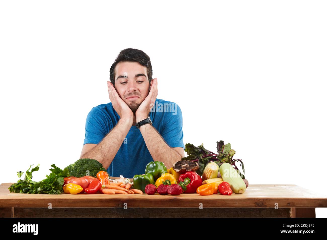 Hes not happy about his new diet. Studio shot of a young man looking ...