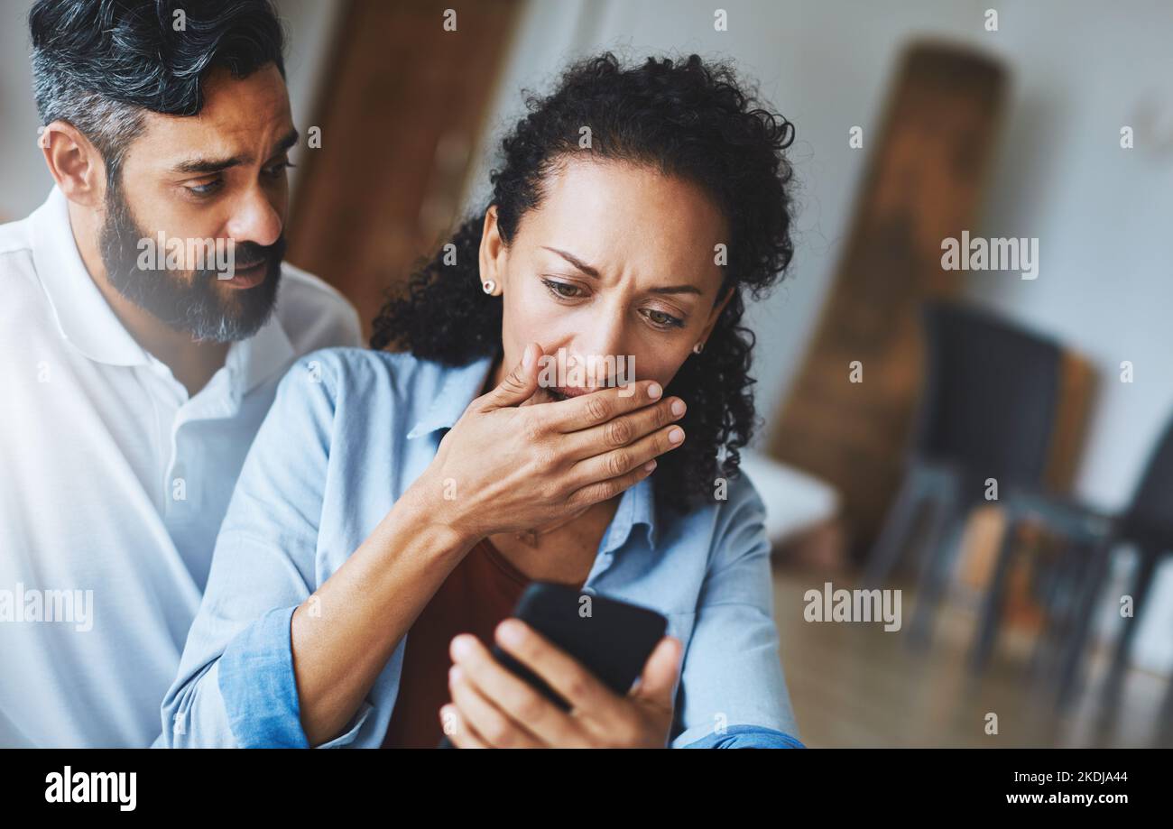 How could this happen. a dismayed couple receiving bad news via a ...