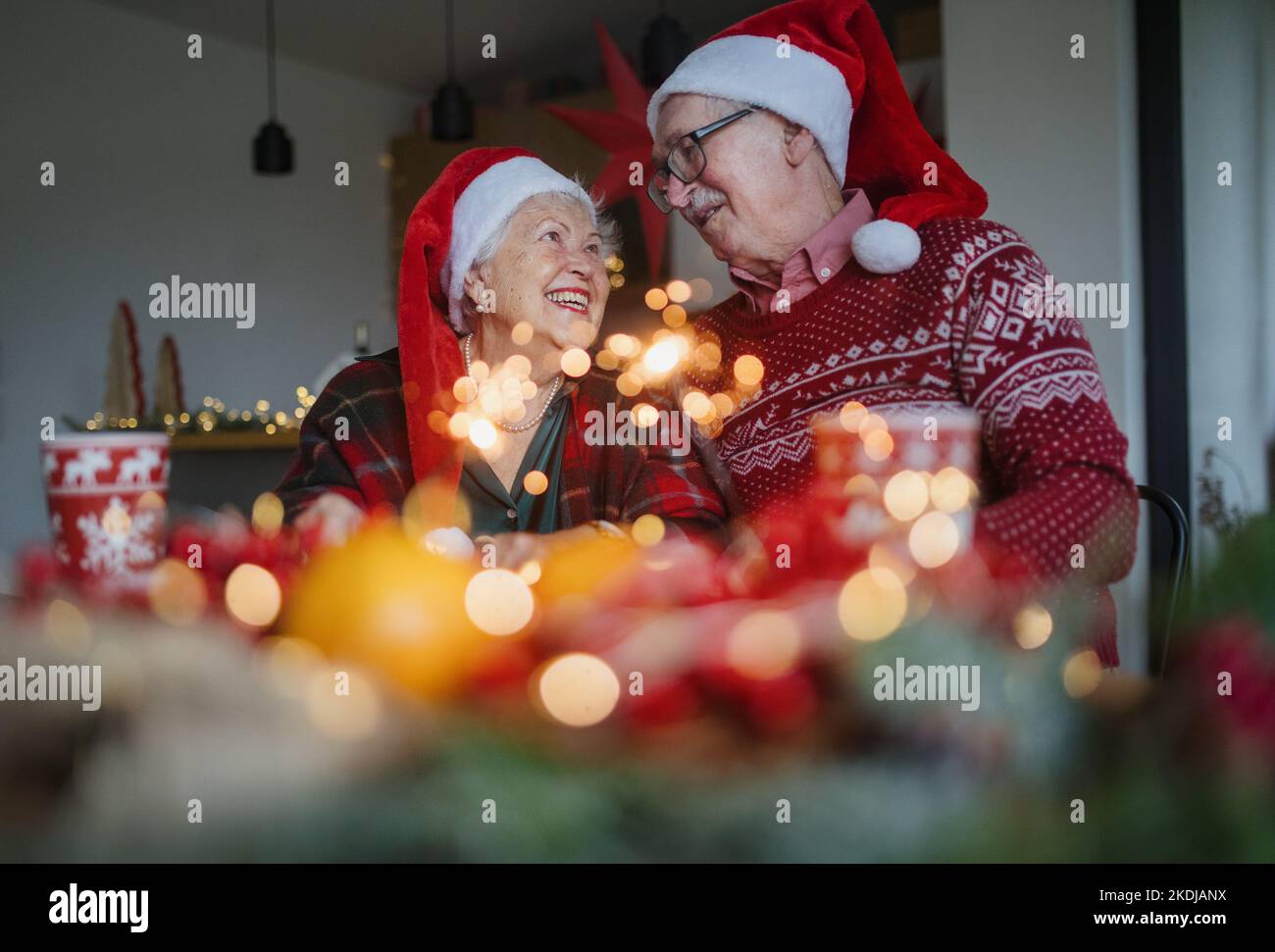 Happy senior couple celebrating Christmas Eve with sparklers Stock ...
