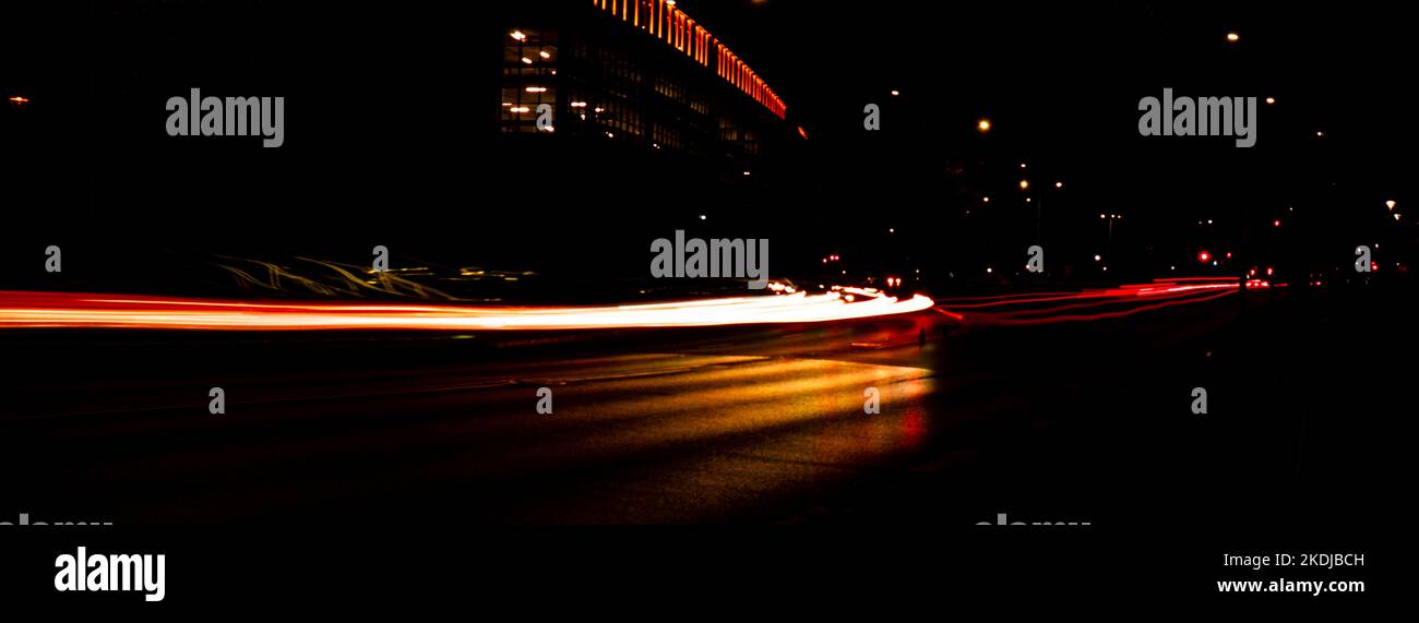 Lights of cars at night. Street line lights. Night highway city. Long ...