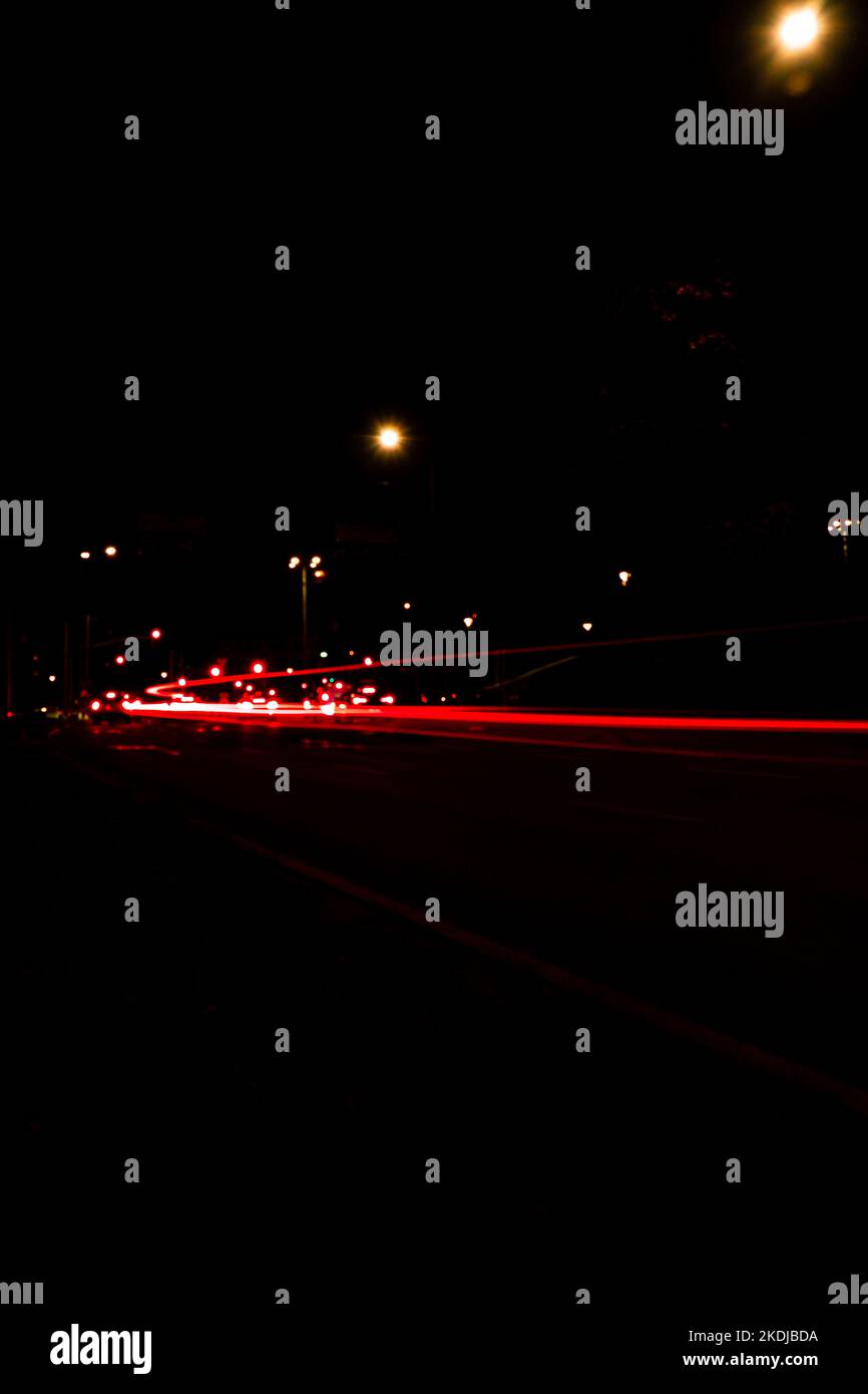 Lights of cars at night. Street line lights. Night highway city. Long ...