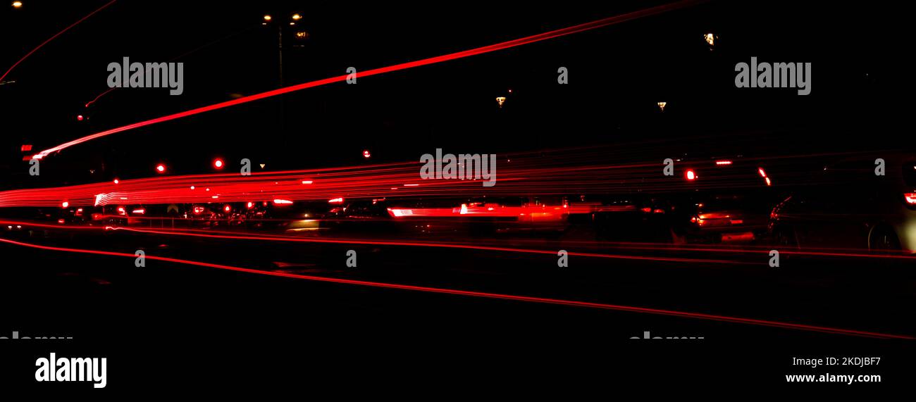 Lights of cars at night. Street line lights. Night highway city. Long ...
