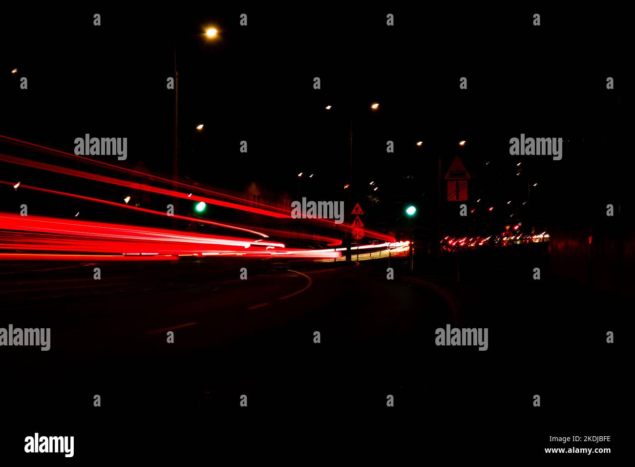 Lights of cars at night. Street line lights. Night highway city. Long ...
