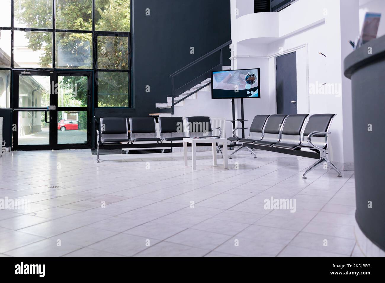interior of empty hospital lobby with big windows waiting for patients ...