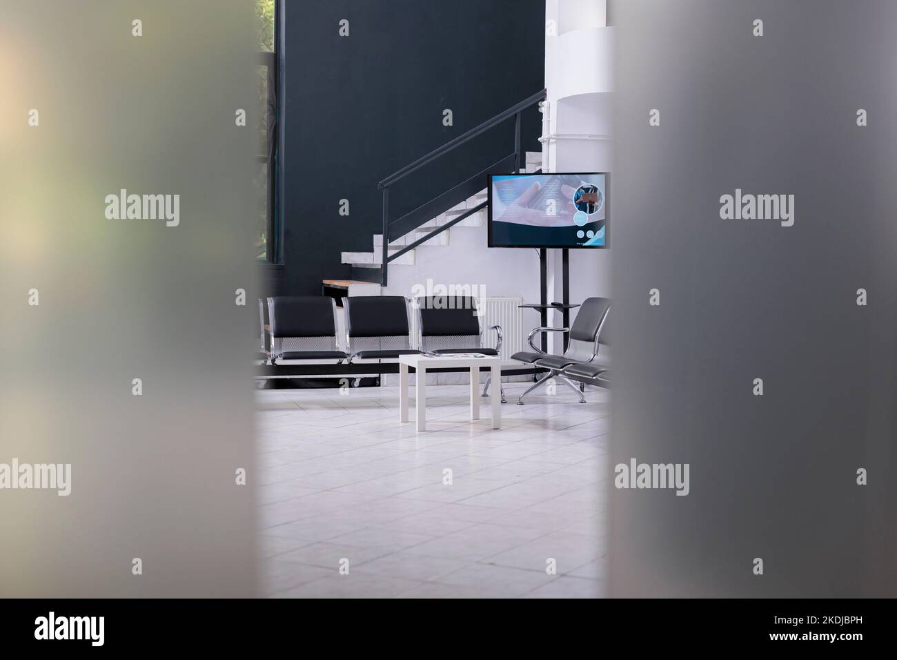 interior of empty hospital lobby with big windows waiting for patients ...