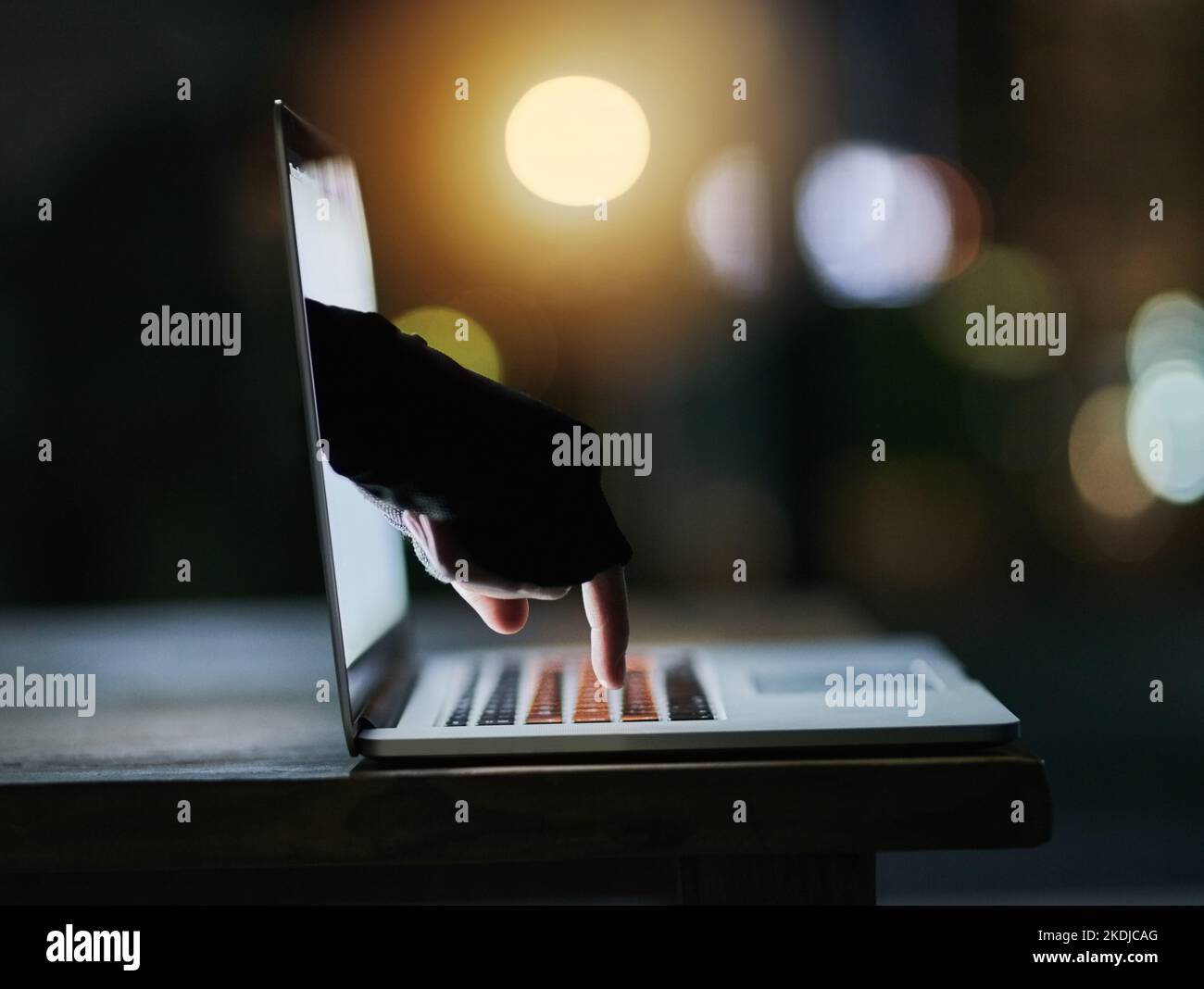 Your laptop is simply a gateway. a hackers disembodied hand reaching ...