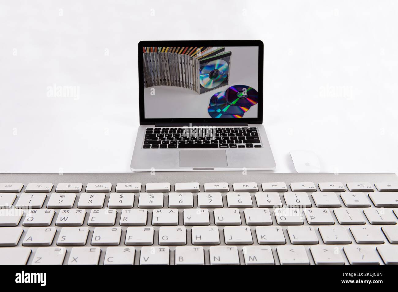 Laptop and keyboard isolated on white background. communication network ...