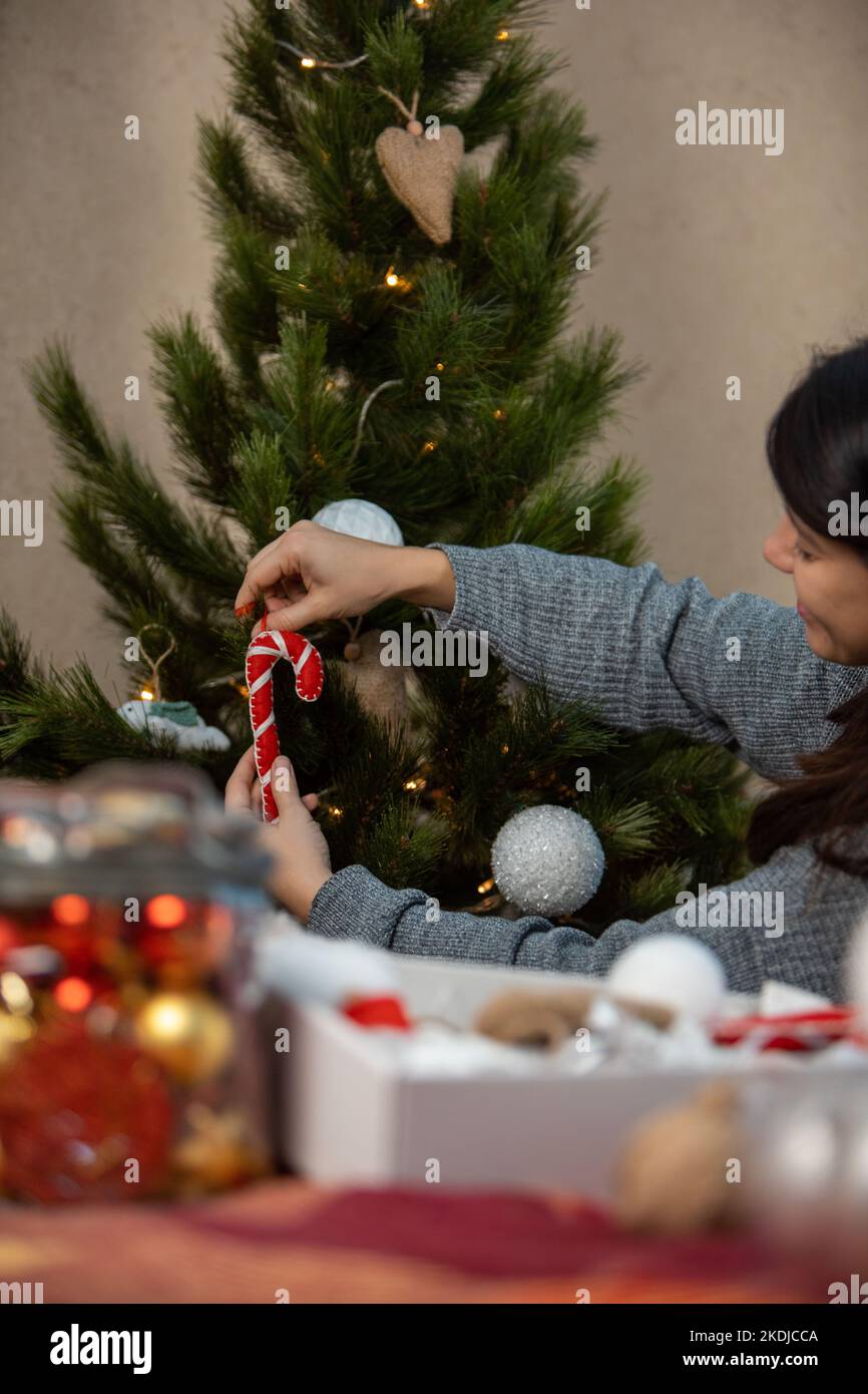 decorating christmas tree inside Stock Photo - Alamy