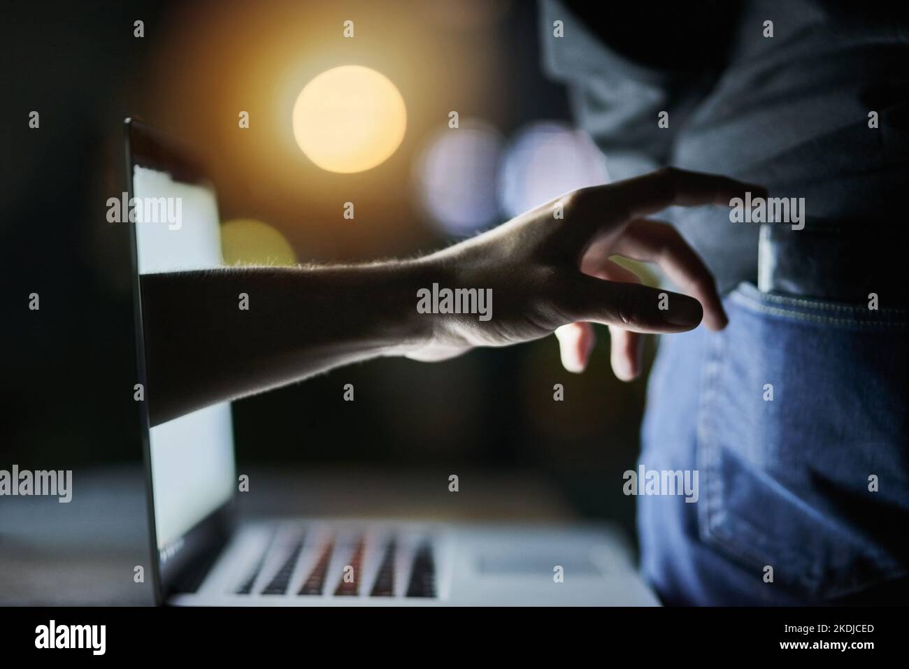 Ill just take that. a disembodied hand reaching through a laptop screen ...