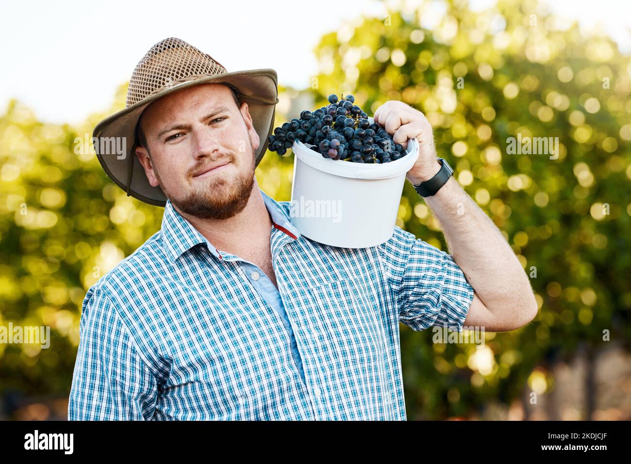 Alls well around the farm when hes around. Portrait of a farmer holding ...
