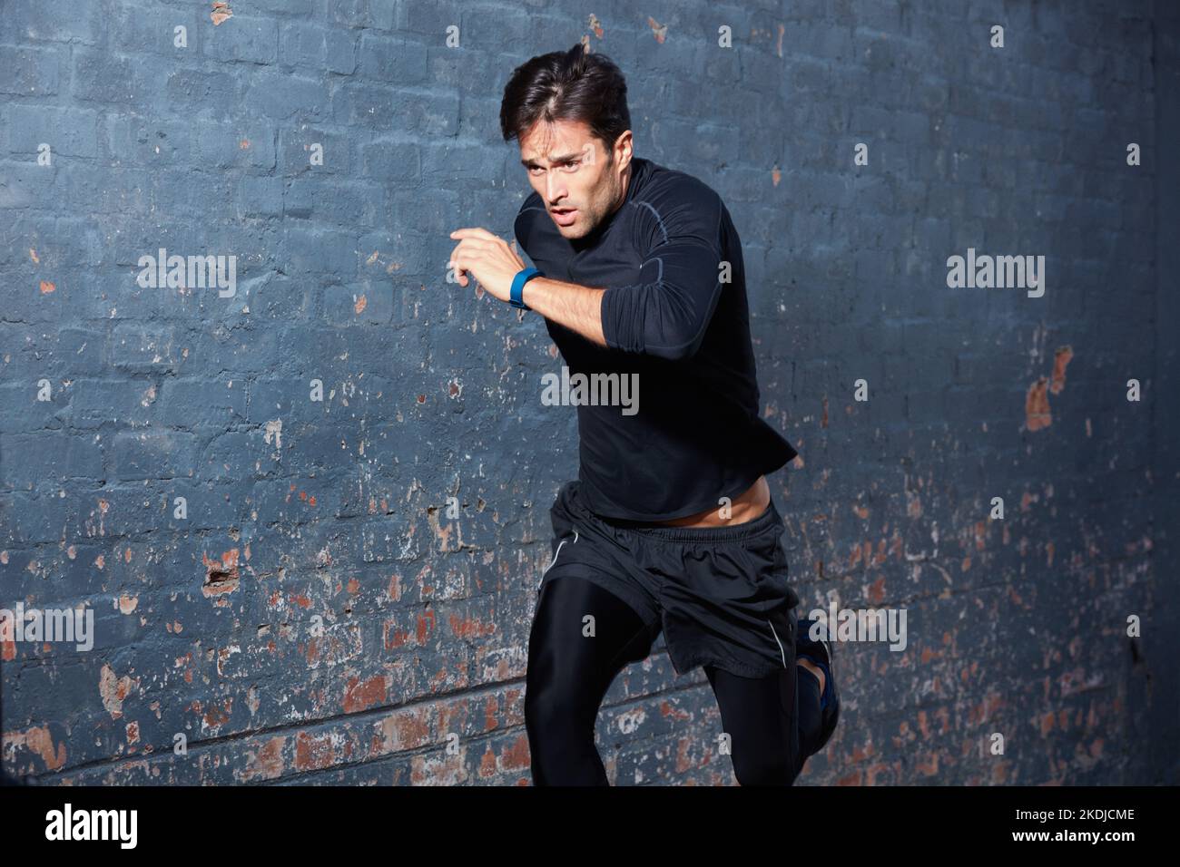 Hes a lean, mean training machine. a focussed young man working out ...