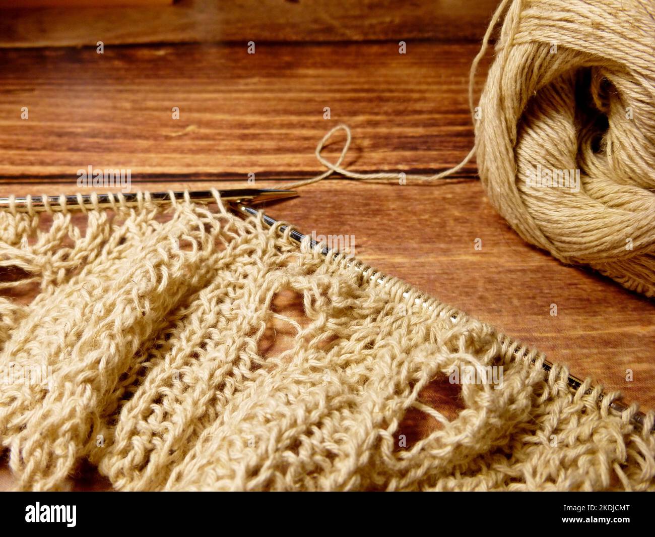 Process of knitting. Knitting needles, loops on knitting needles ...