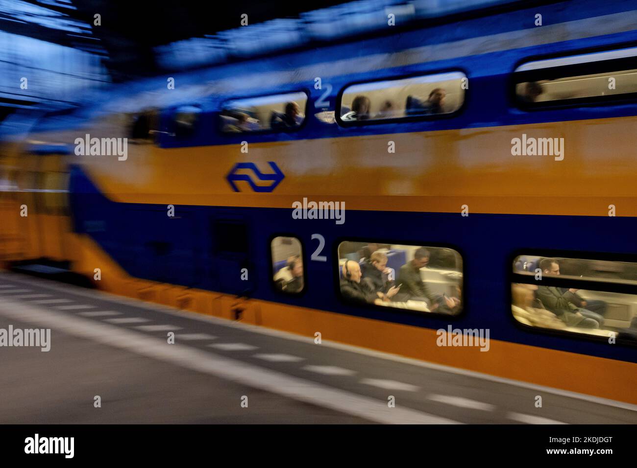 2022-11-07 07:56:48 AMSTERDAM - A train departs from Amsterdam Central ...