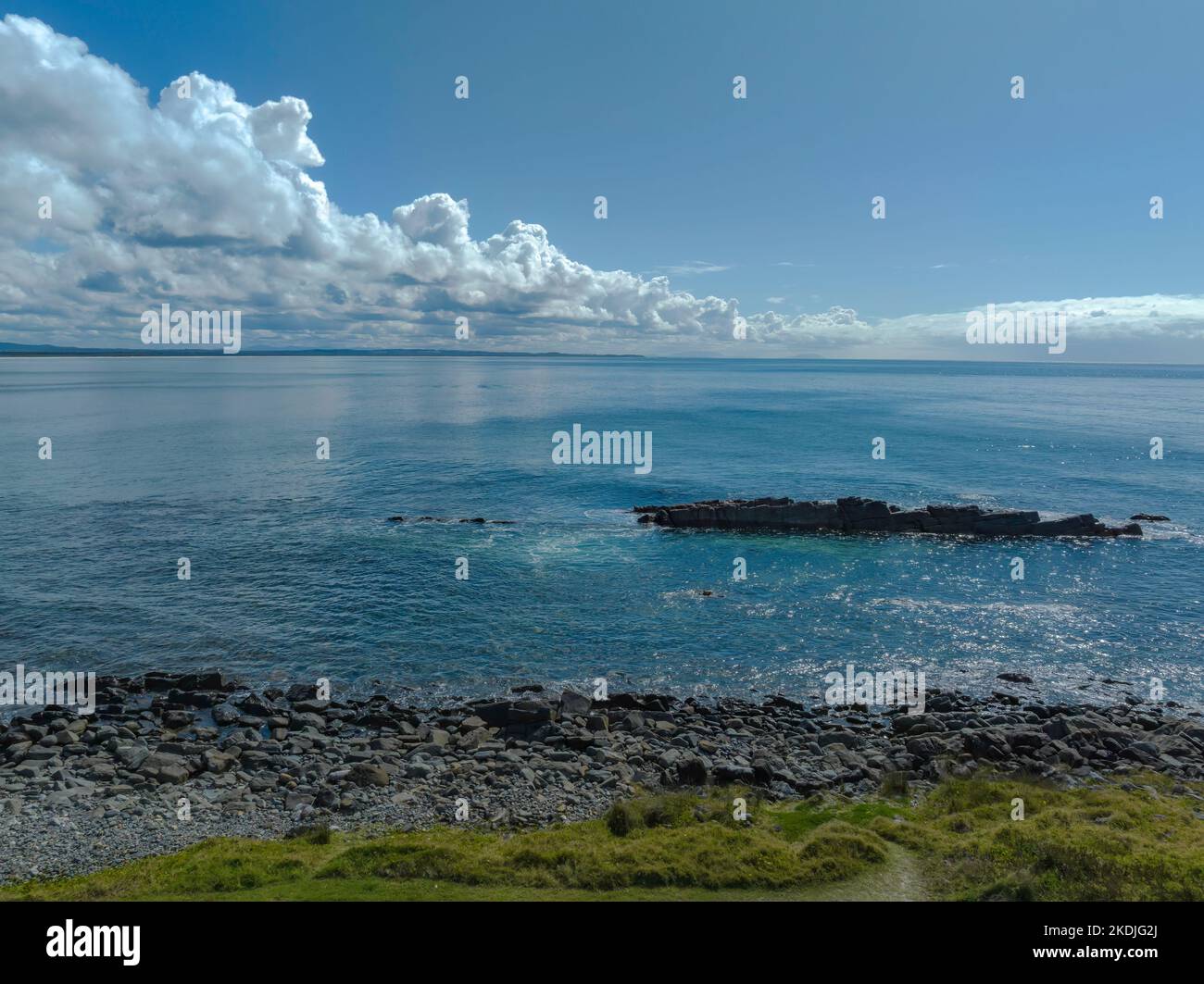 Daytime seascape with clouds at Pebbly Beach in Forster on the ...