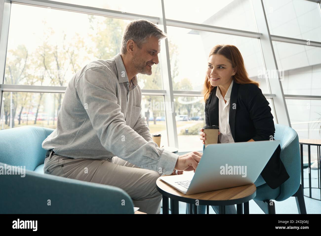 Office employees look through the work material in the laptop Stock ...