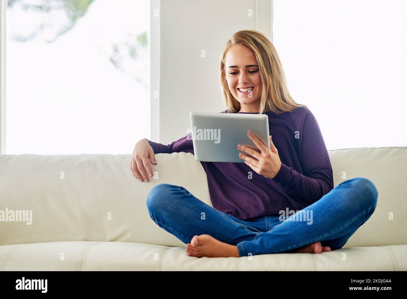 She loves spending time online. Full length shot of an attractive young ...