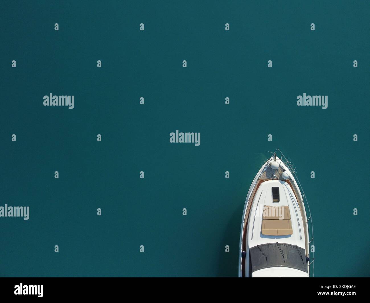 Aerial yacht on calm sea. Luxury cruise trip. View from above of white ...