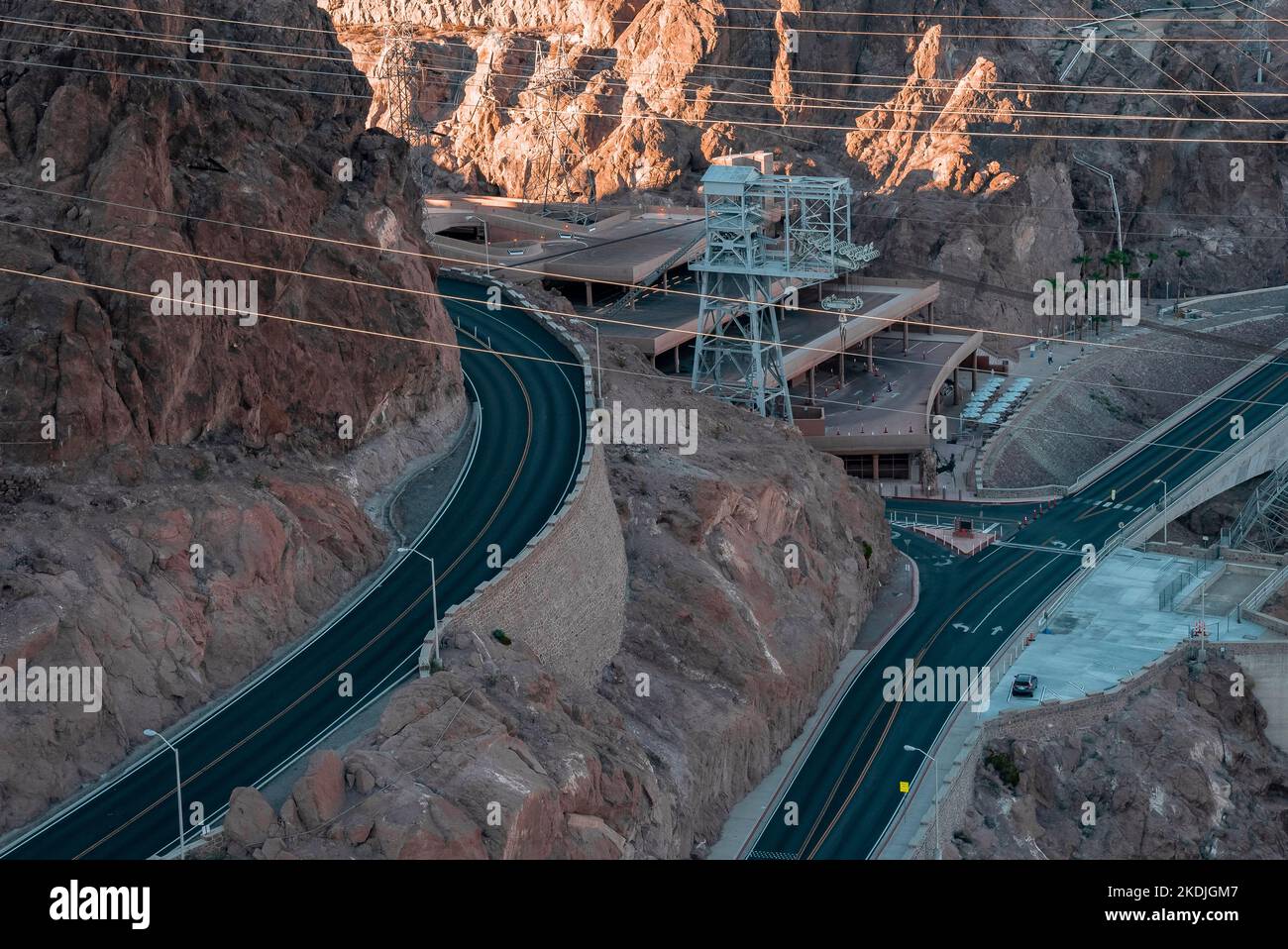 Aerial View Of Cables Over Bridge And Winding Road Stock Photo - Alamy