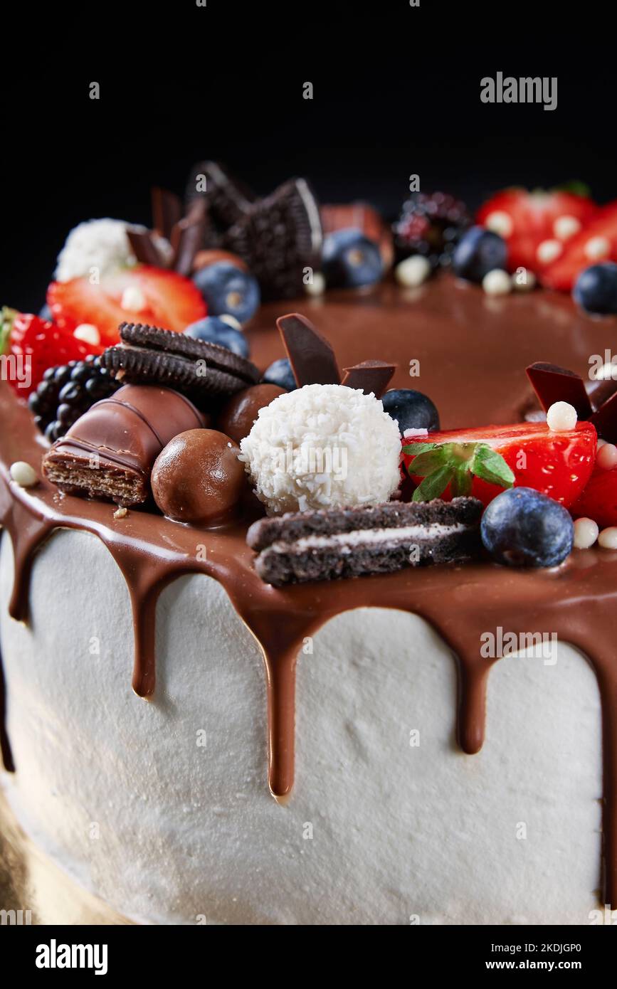 Birthday cake on dark background. Close up of cake decorated with fresh ...