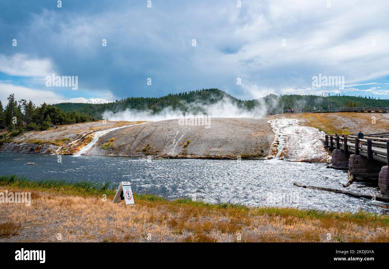 Scenic view of eruption by Firehole River in Midway Geyser at ...