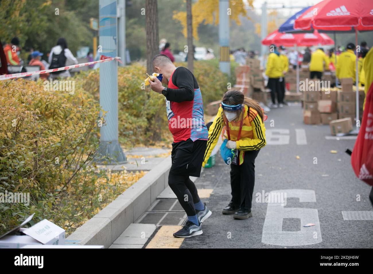 Volunteers work hard in the 2022 Beijing Marathon, Beijing, China, 6 ...