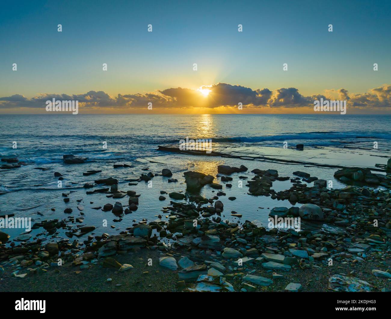 Aerial sunrise sea views with sun rays from The Skillion at Terrigal on ...