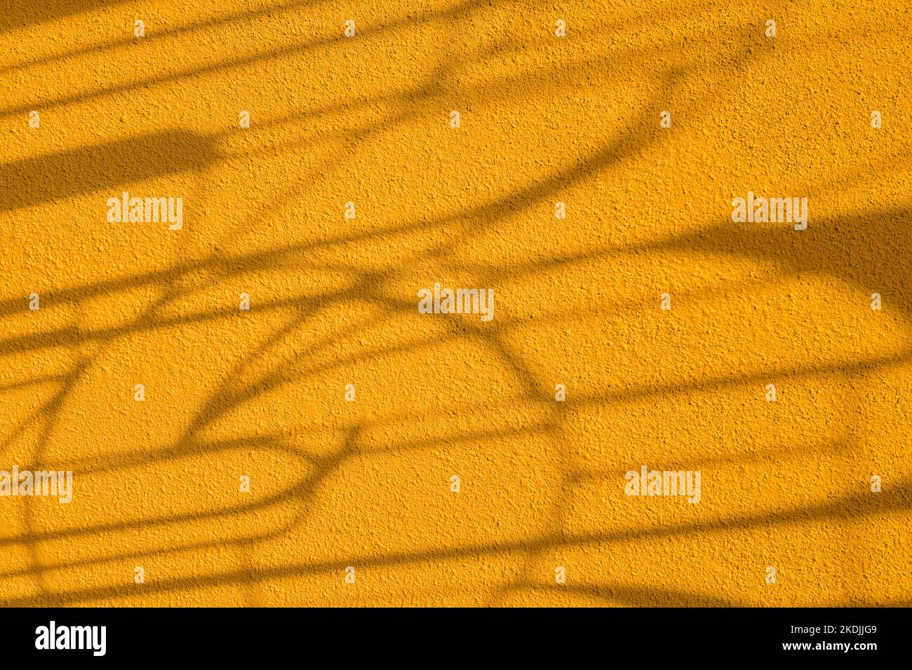 Shadow and light on solid yellow wall texture background Stock Photo ...