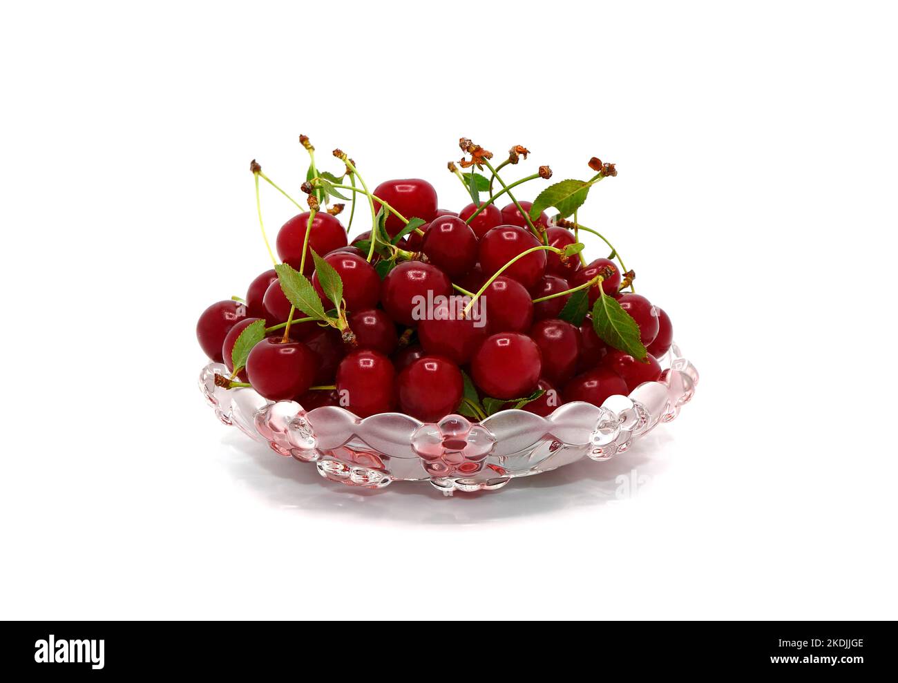 Ripe cherry in a translucent beautiful plate on a light background ...
