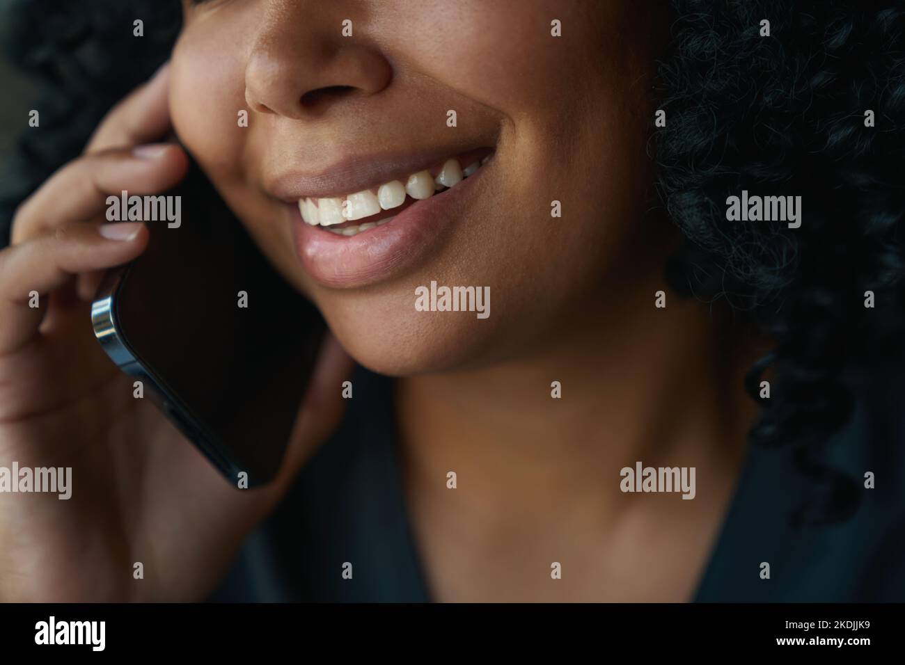 African american woman holding phone to her ear and talking Stock Photo ...