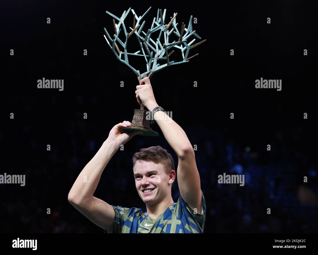 Paris, France. 6th Nov, 2022. Holger Rune of Denmark displays his trophy during the awarding ...
