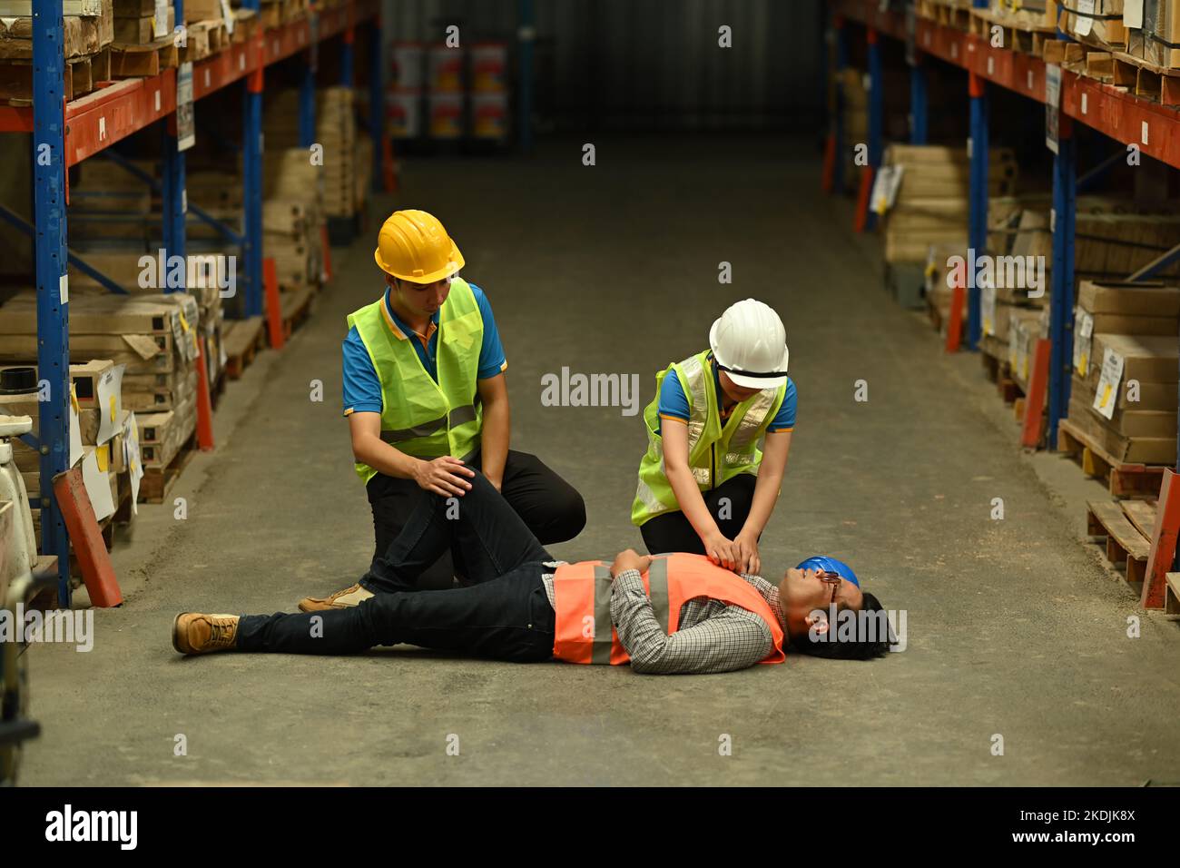 Warehouse workers are helping and giving the injured first aid to ...