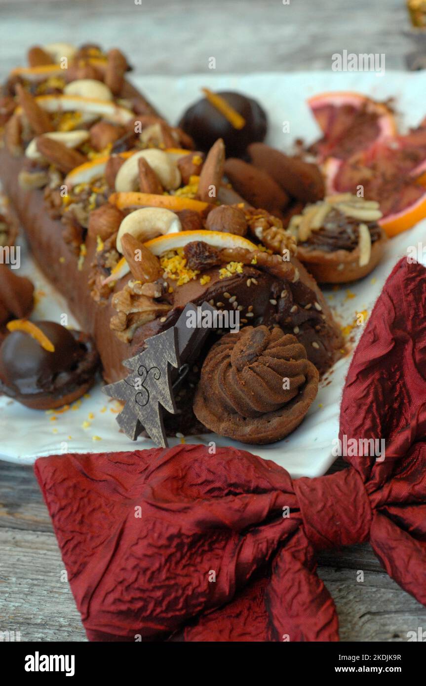 Homemade Yule log, chocolate, dried fruit, orange peel Stock Photo - Alamy
