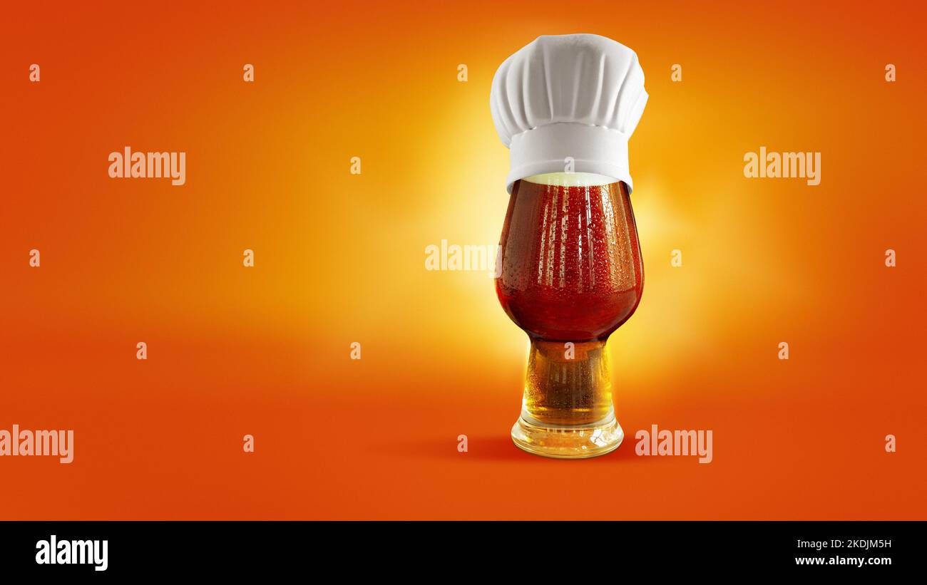 Cook. Full glass of frothy beer wearing chef's hat isolated over ...