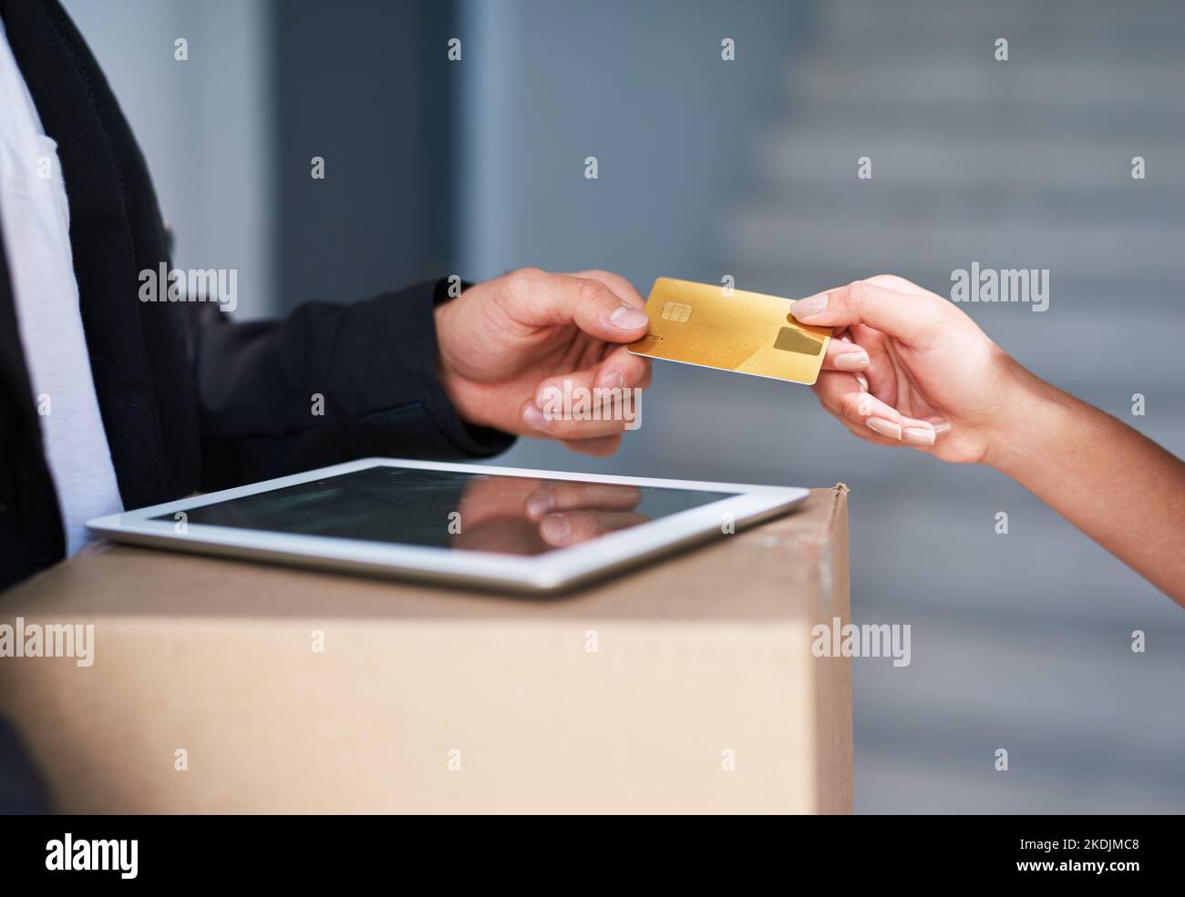The convenient way to pay. a customer using a credit card to pay for a ...