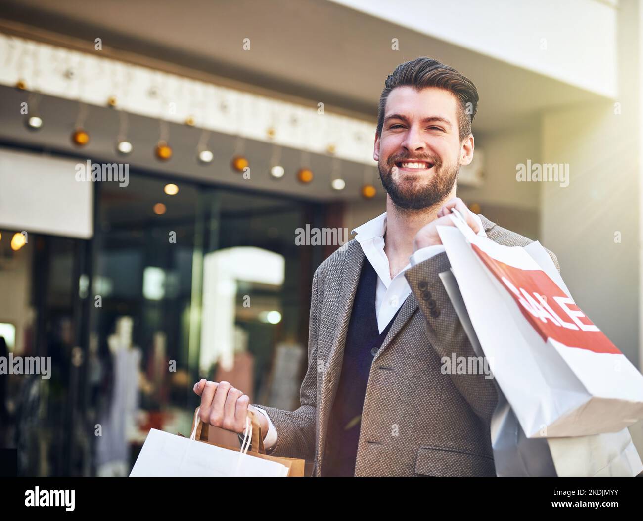Man carrying shopping bags hi-res stock photography and images - Alamy