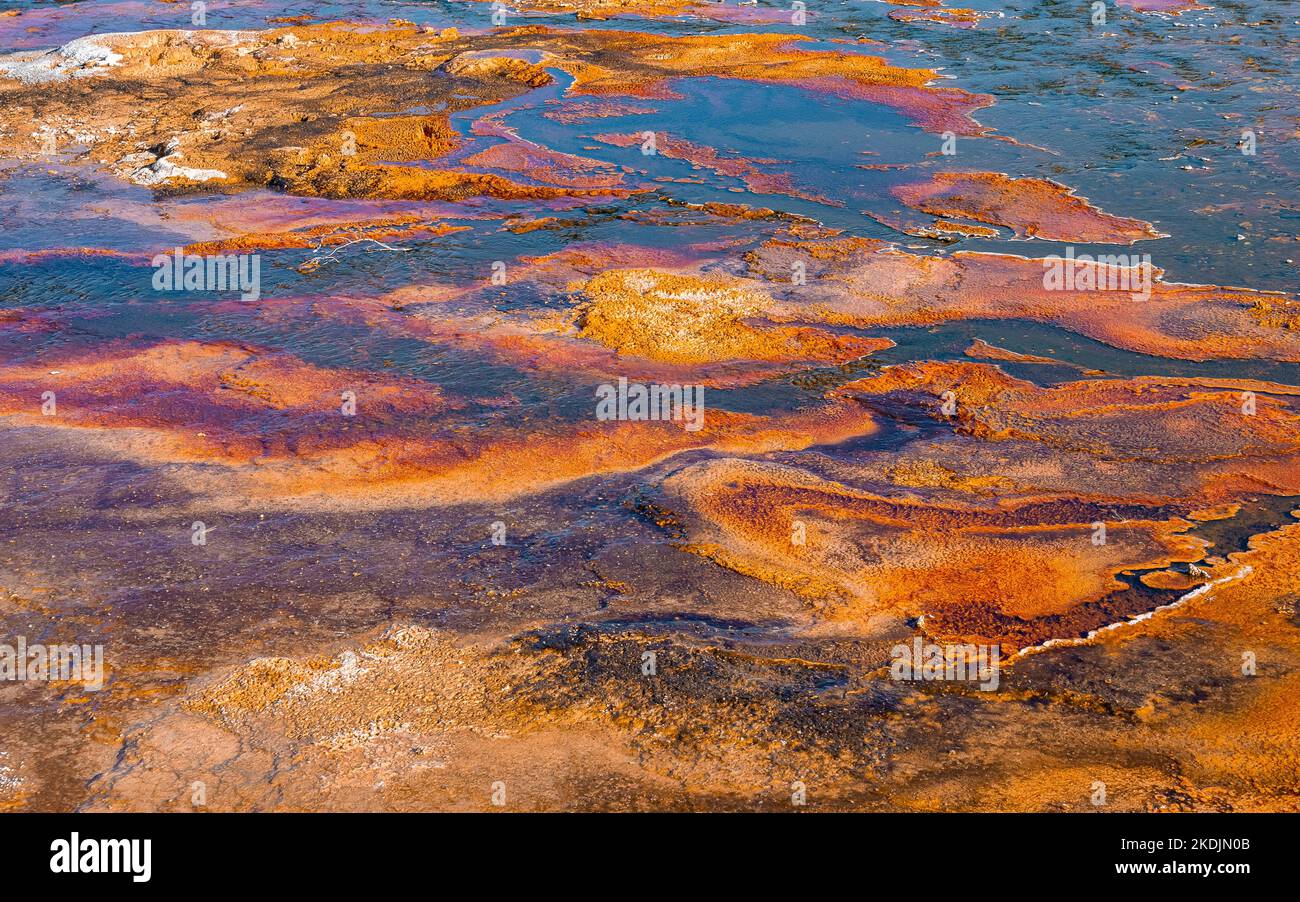 Textured surface of geothermal landscape in geyser basin at National ...
