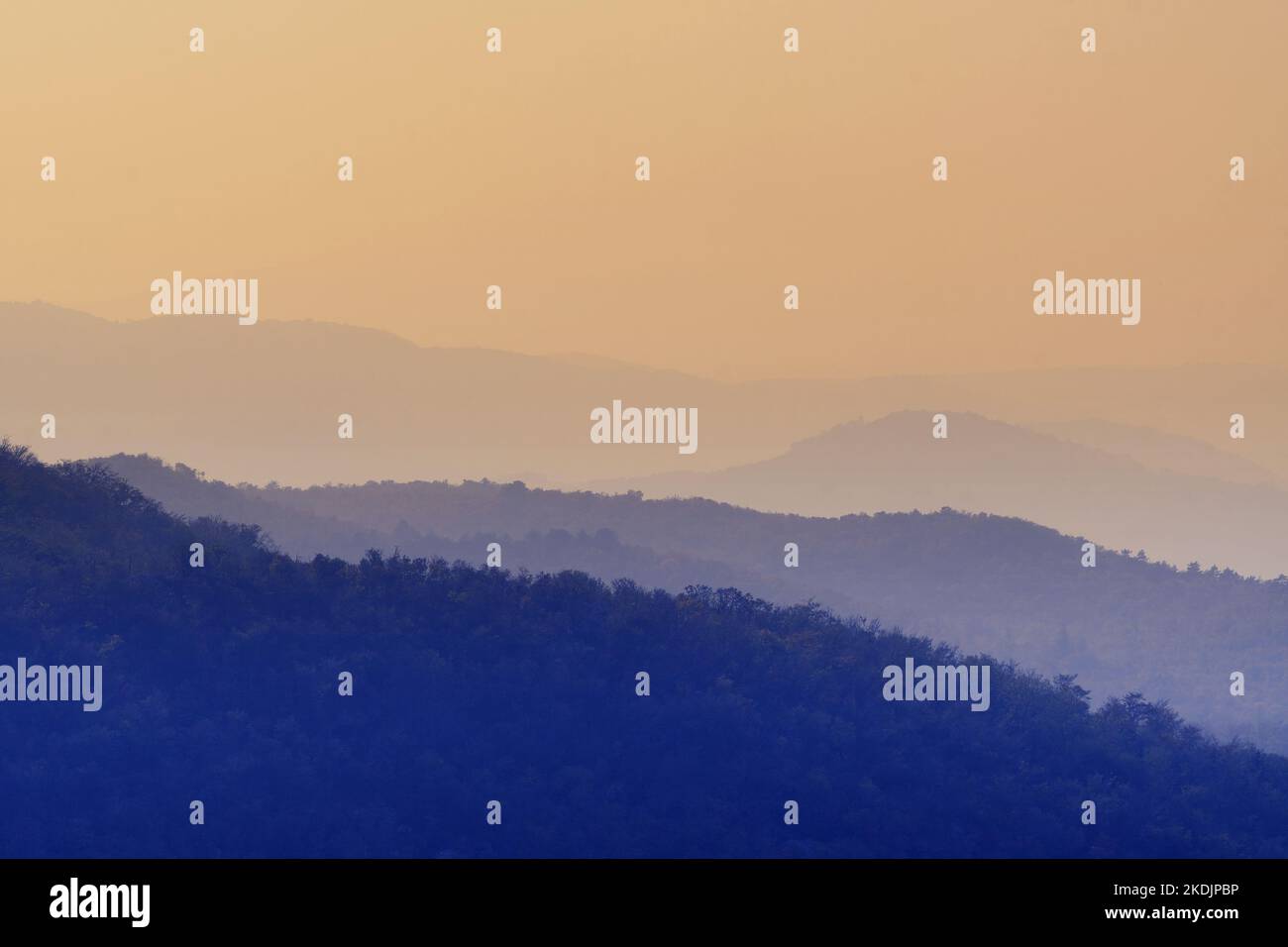 Bluish colored hazy layers of hills at sunset. Landscapes, environment ...