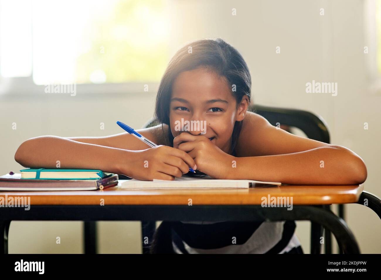 School is my happy place. Portrait of a young schoolgirl doing her ...
