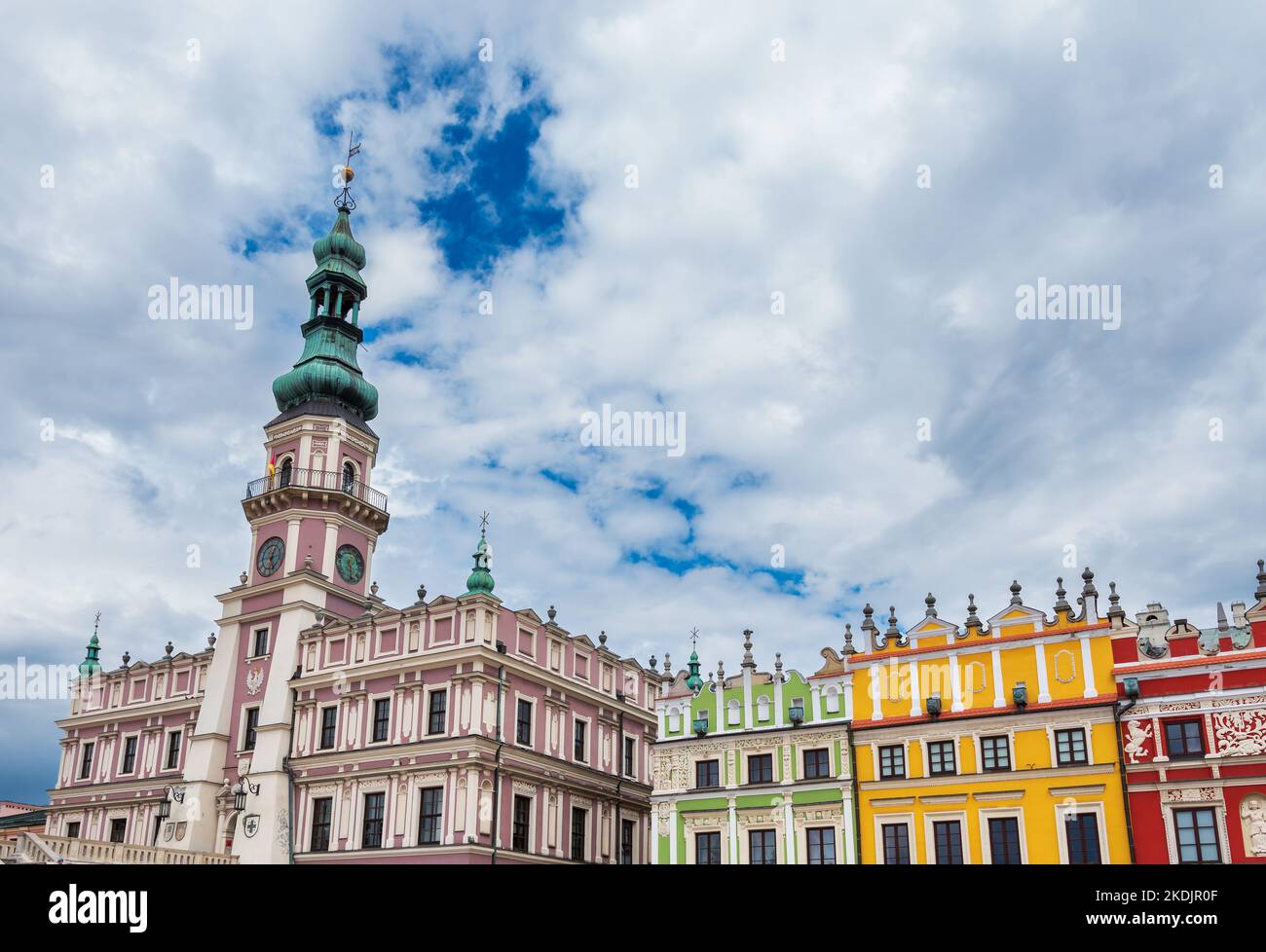 A beautiful Renaissance town hall with multi-colored tenement houses ...