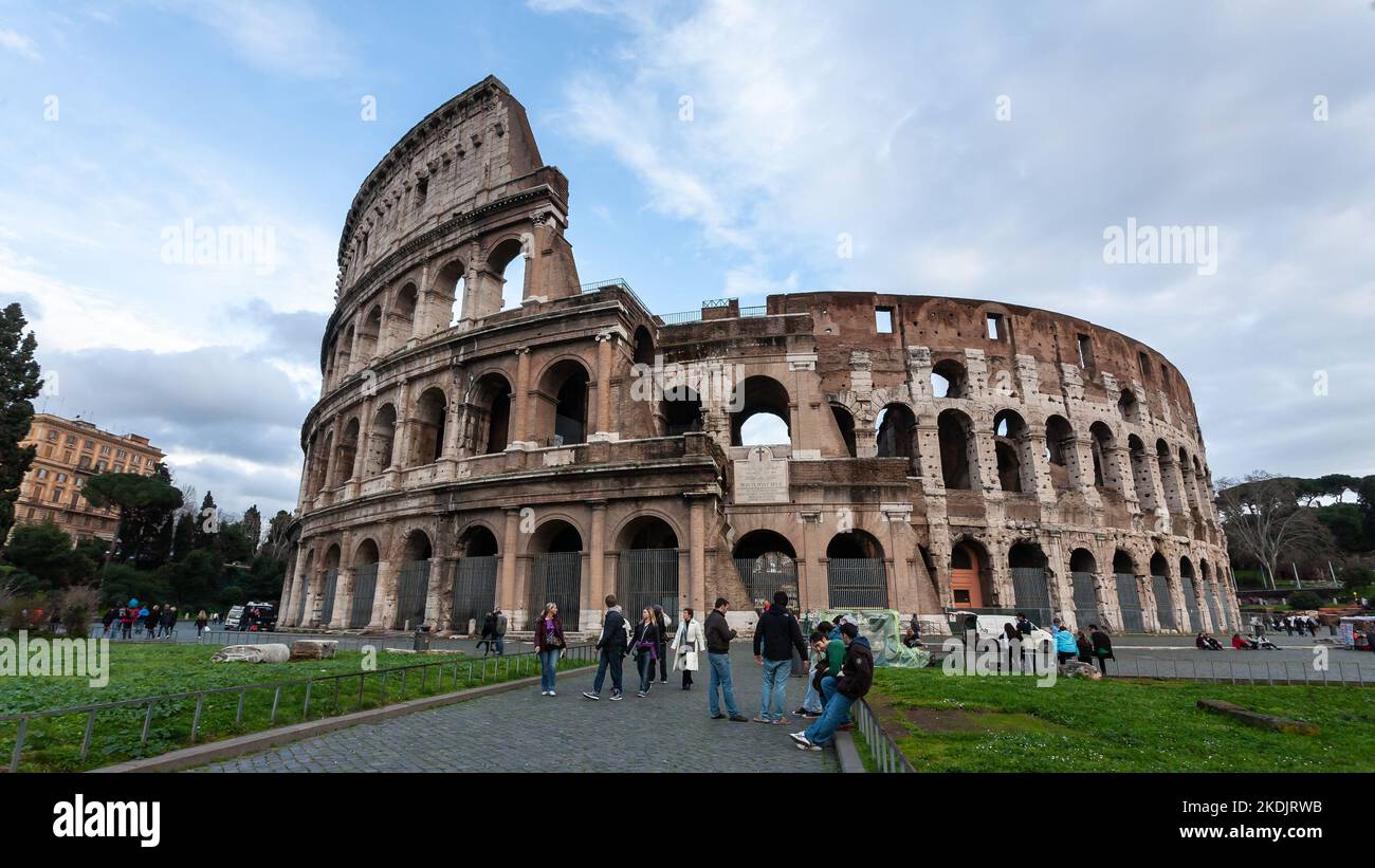 Tourists walking among the ruins of the Roman Colosseum, Rome, Italy ...